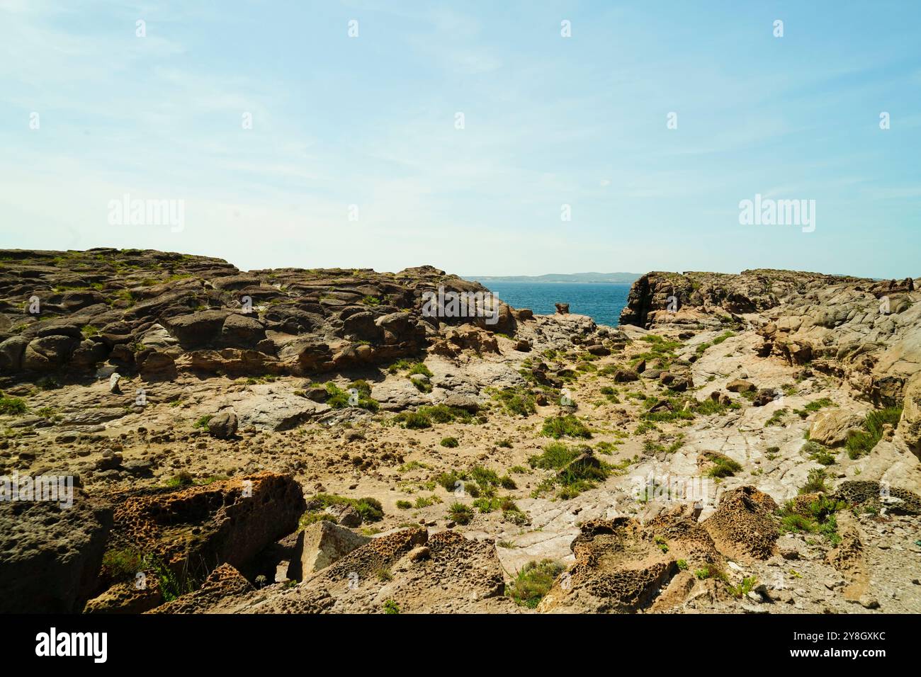 The Faraglioni of Nido dei Passeri, on the coast of Calasetta on the ...