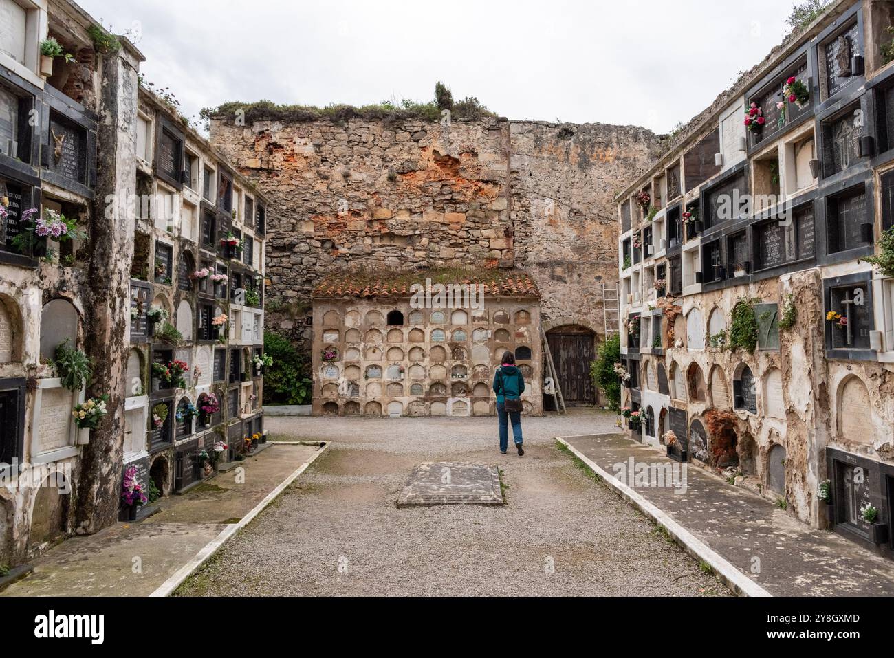 Sliding graves at the old historic stone cemetery in Comillas, Cantabria in Spain Stock Photo ...
