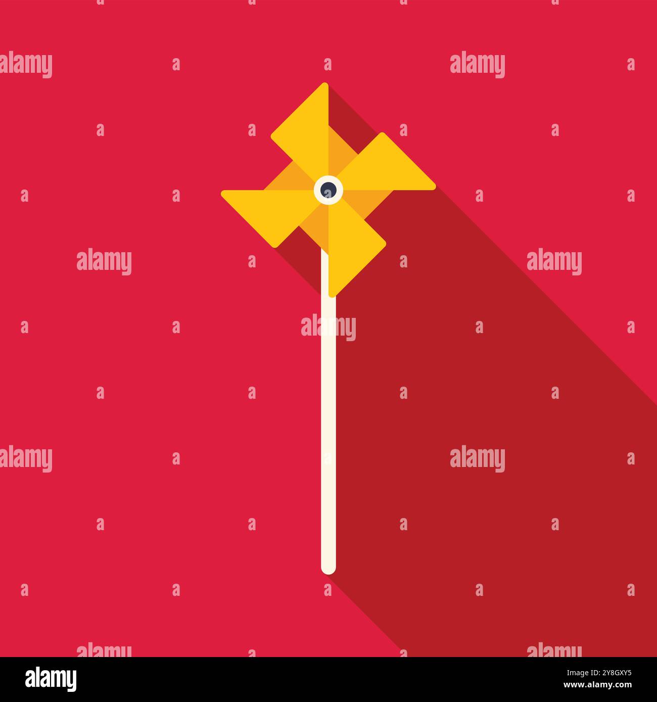 Yellow pinwheel toy spinning in the wind casting a shadow on a red ...