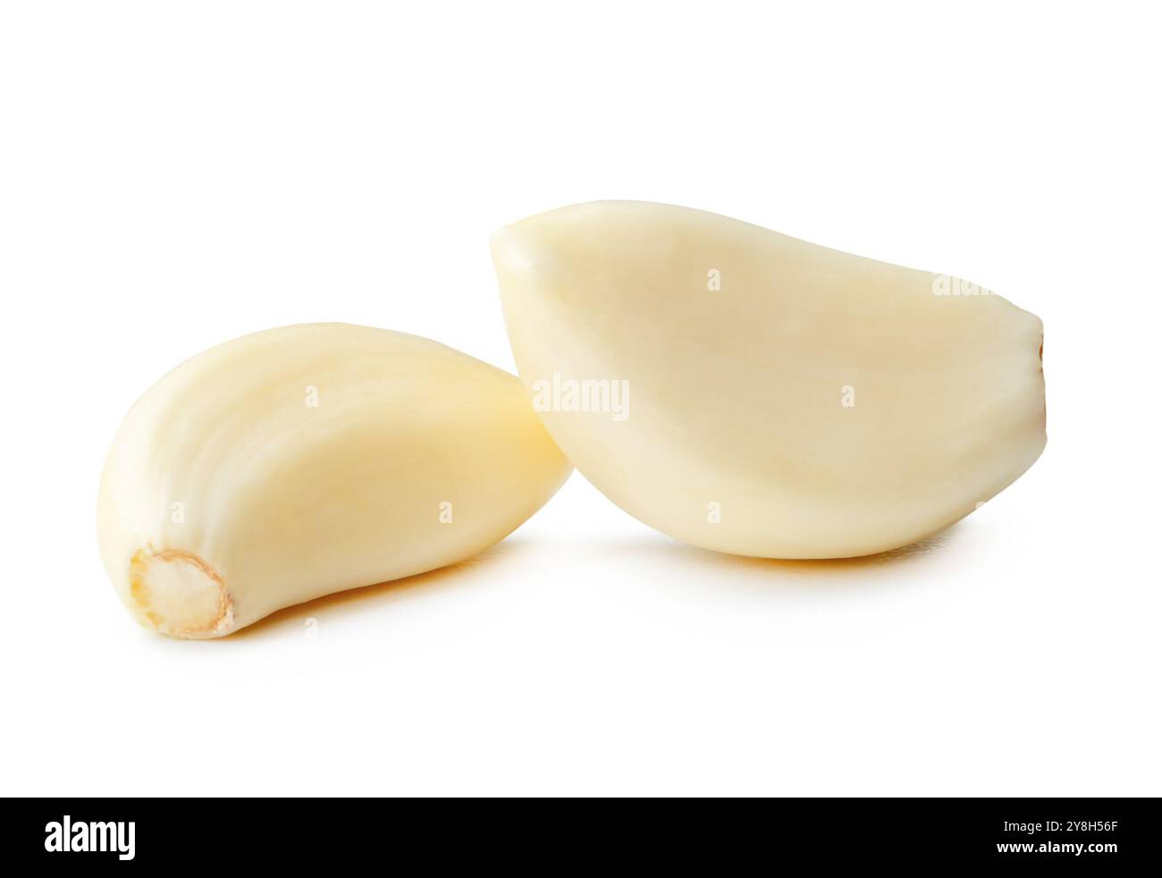 Side view of peeled garlic cloves in stack is isolated on white ...