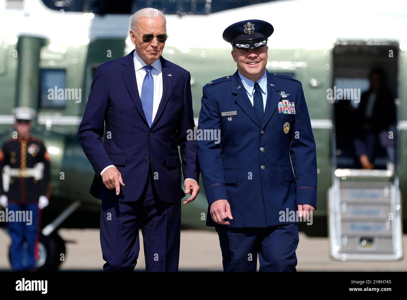 President Joe Biden walks with Col. Paul Pawluk, Vice Commander of the ...