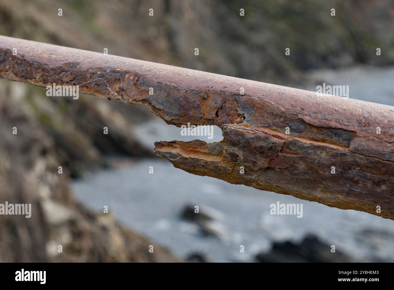 Rusty railing by the sea battered bt the Atlantic sea salted water ...