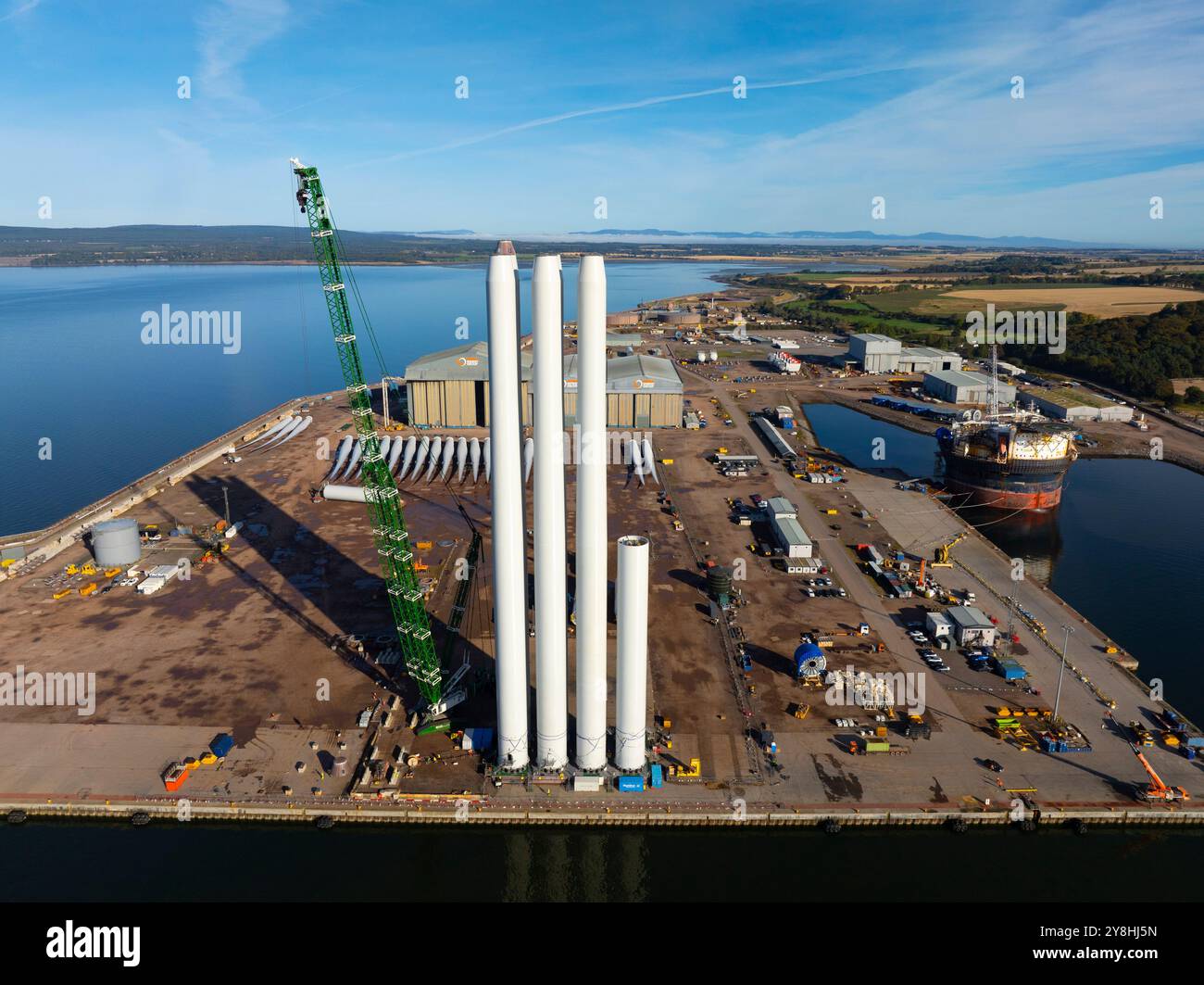 Aerial view from drone of offshore wind turbine towers being erected at ...