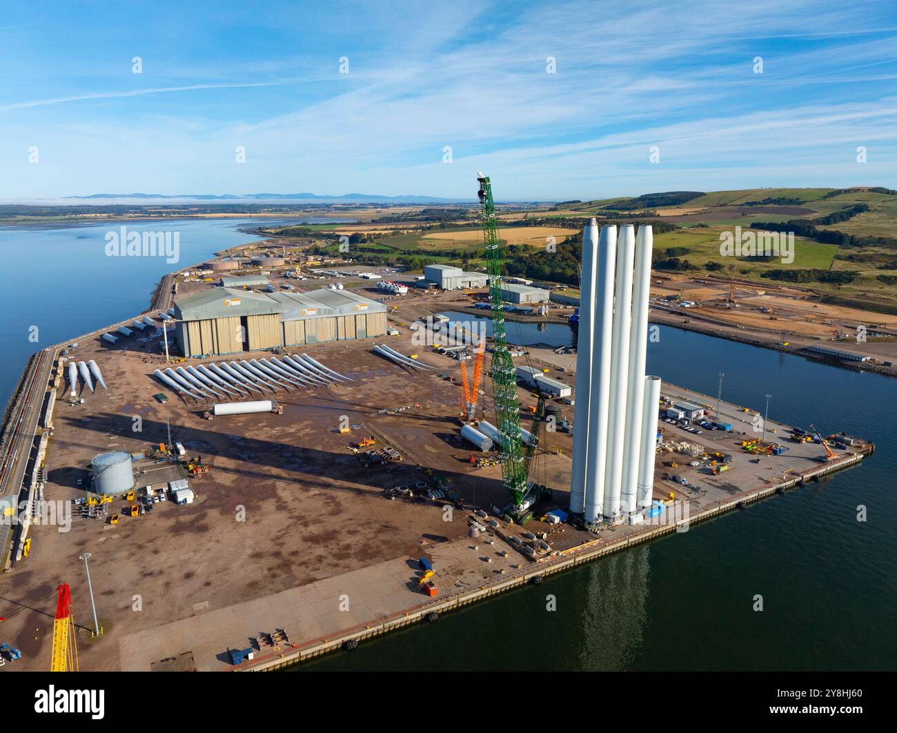 Aerial view from drone of offshore wind turbine towers being erected at ...