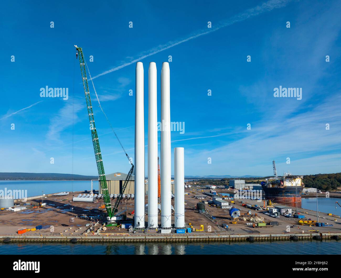 Aerial view from drone of offshore wind turbine towers being erected at ...