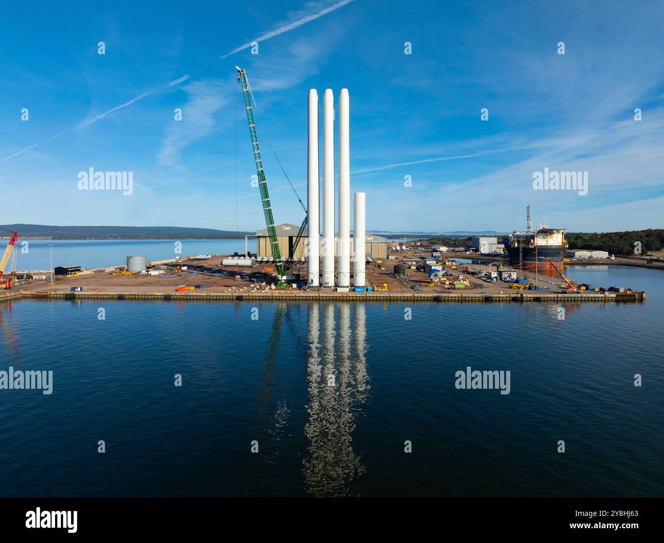 Aerial view from drone of offshore wind turbine towers being erected at ...