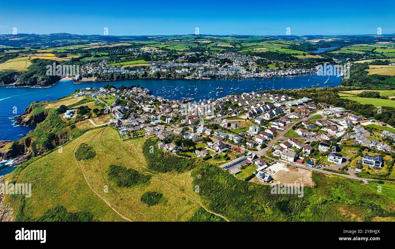 Aerial view of a picturesque coastal village surrounded by lush green ...