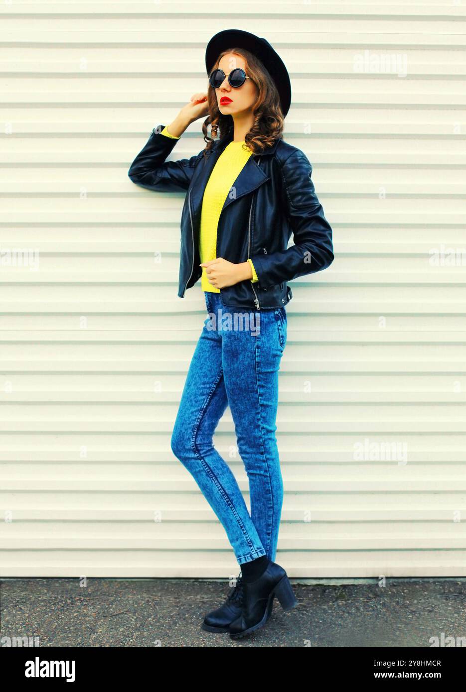 Fashionable stylish young woman model full length posing in black ...