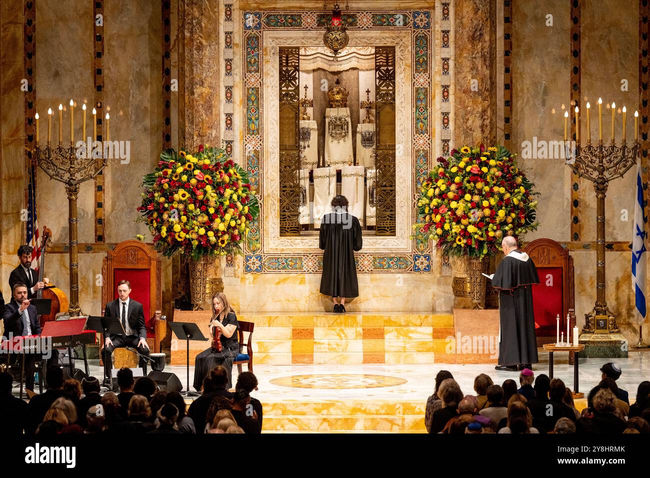 Cardinal Timothy Dolan and Rabbi Amy Ehrlich pray in front of opened ...