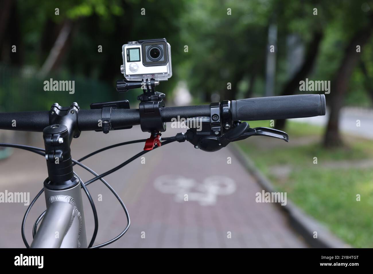 Modern action camera with mount on bicycle outdoors, closeup Stock ...