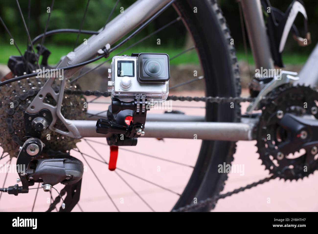 Modern action camera with mount on bicycle outdoors, closeup Stock ...