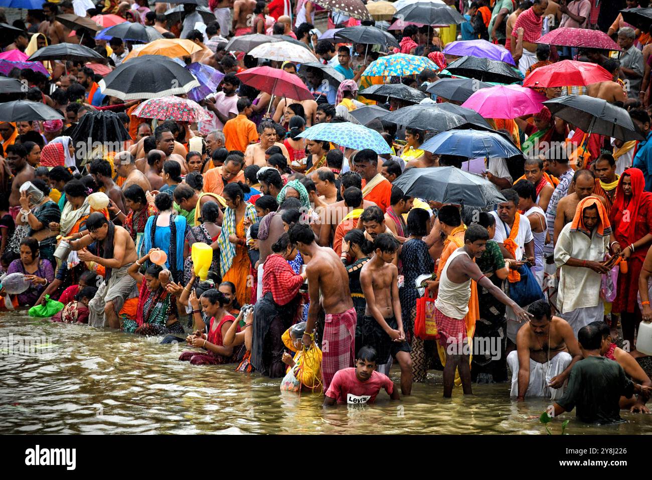 Thousands of devotees are seen in the River Ganges taking bath during ...