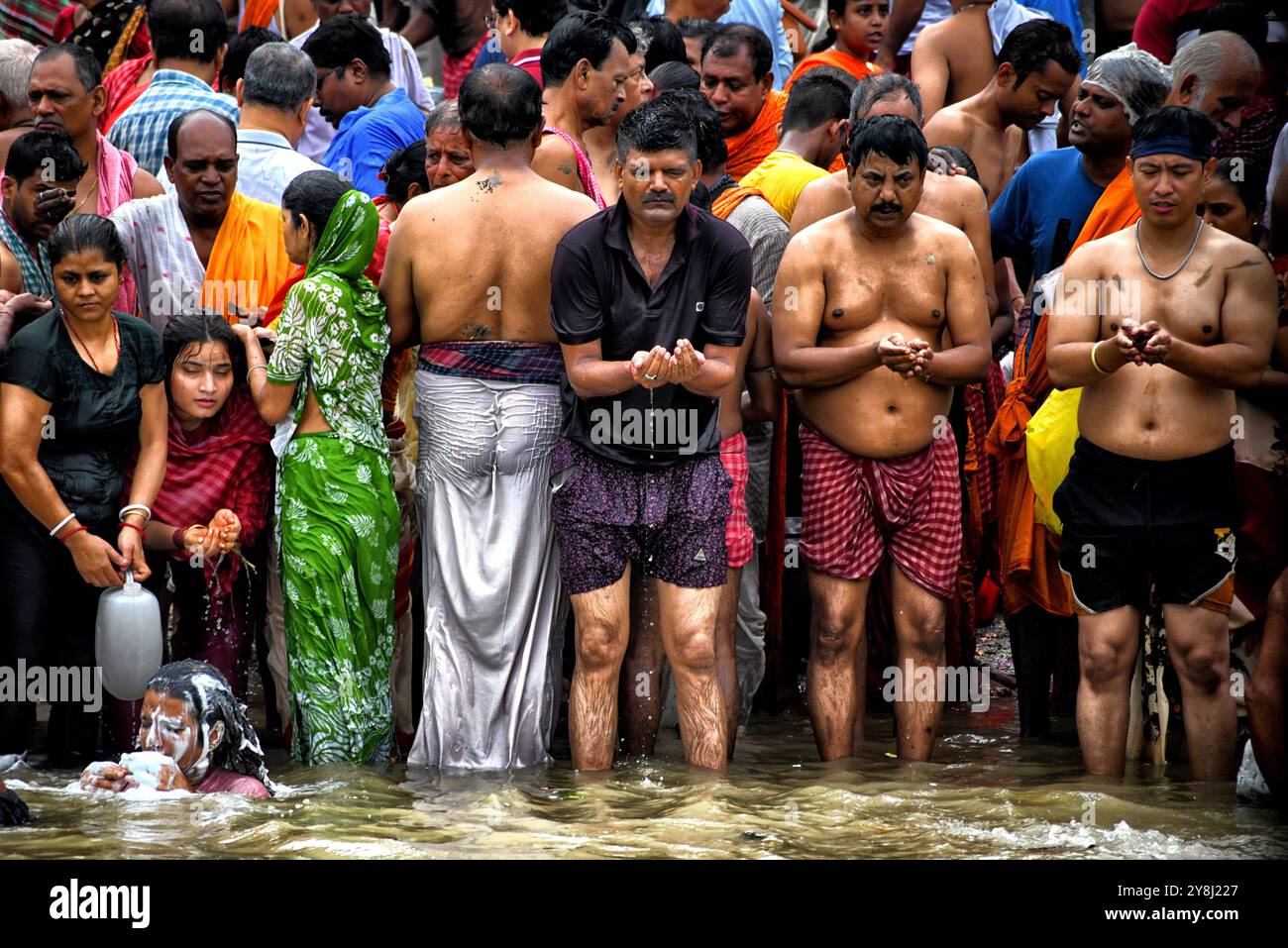 Hindu devotees offer their prayers to their ancestors during the ...