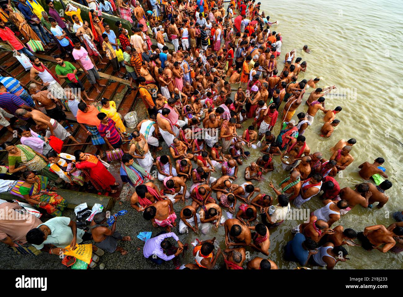 Thousands of devotees are seen in the River Ganges during the Mahalaya ...