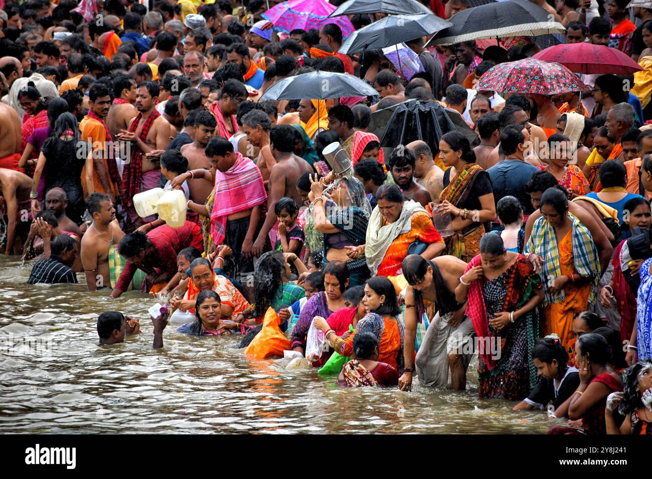 Crowds of devotees are seen in the River Ganges during the celebration ...