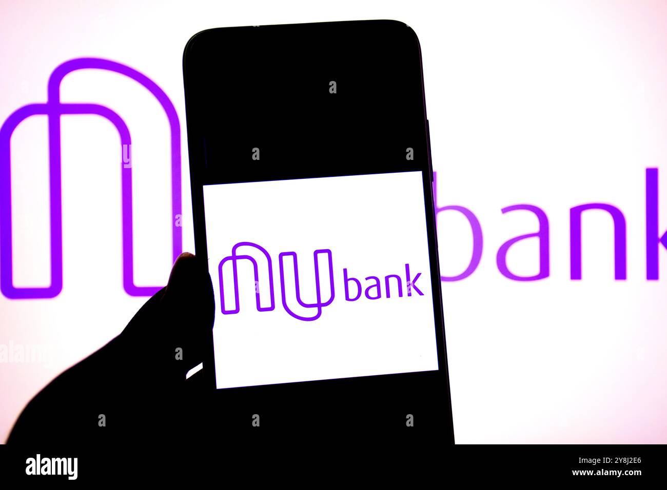 In this photo illustration, a Nu bank logo seen displayed on a ...