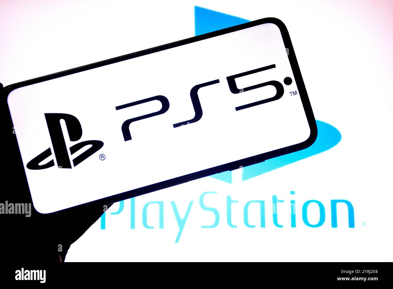 In this photo illustration, a PS5 logo seen displayed on a smartphone ...