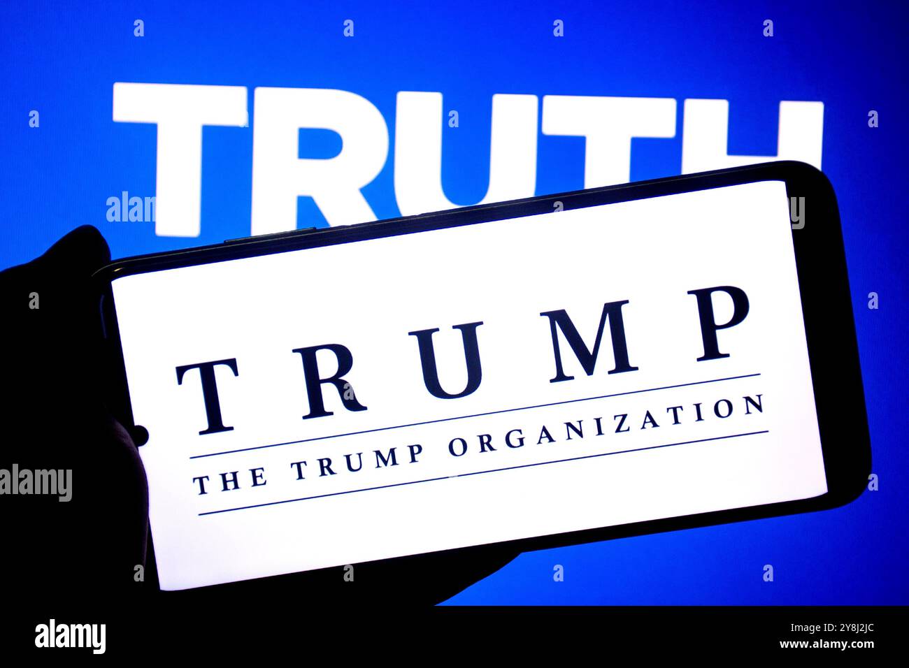 In this photo illustration, The Trump Organization logo seen displayed ...