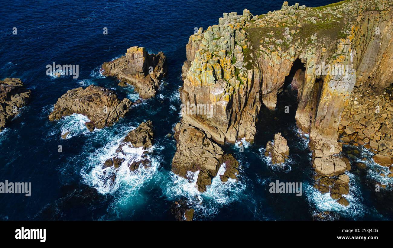 Aerial view of rugged coastal cliffs and rocky formations surrounded by ...