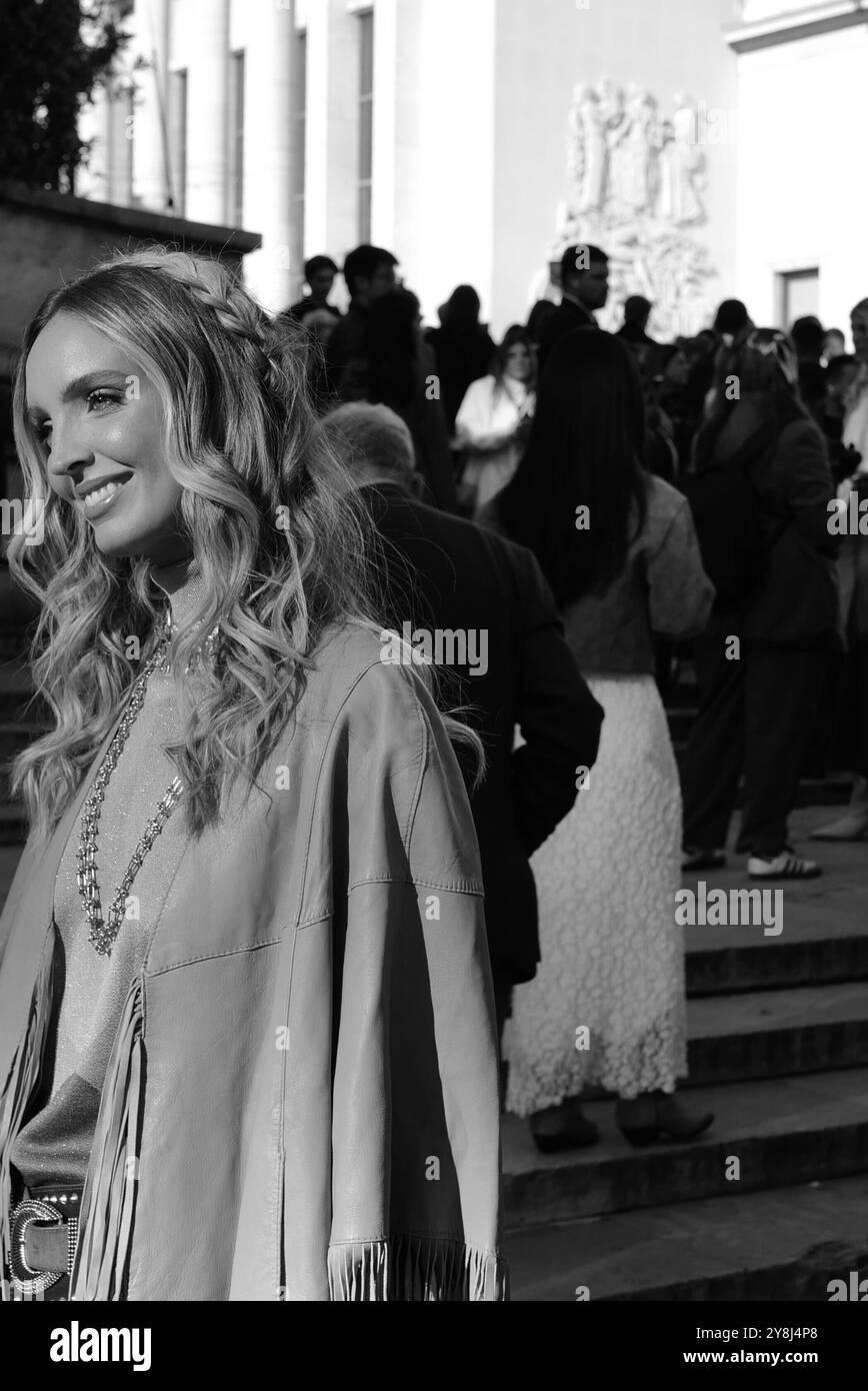 Cris Mata wearing turtle neck sweater, a plaid skirt, wrapped sweater ...