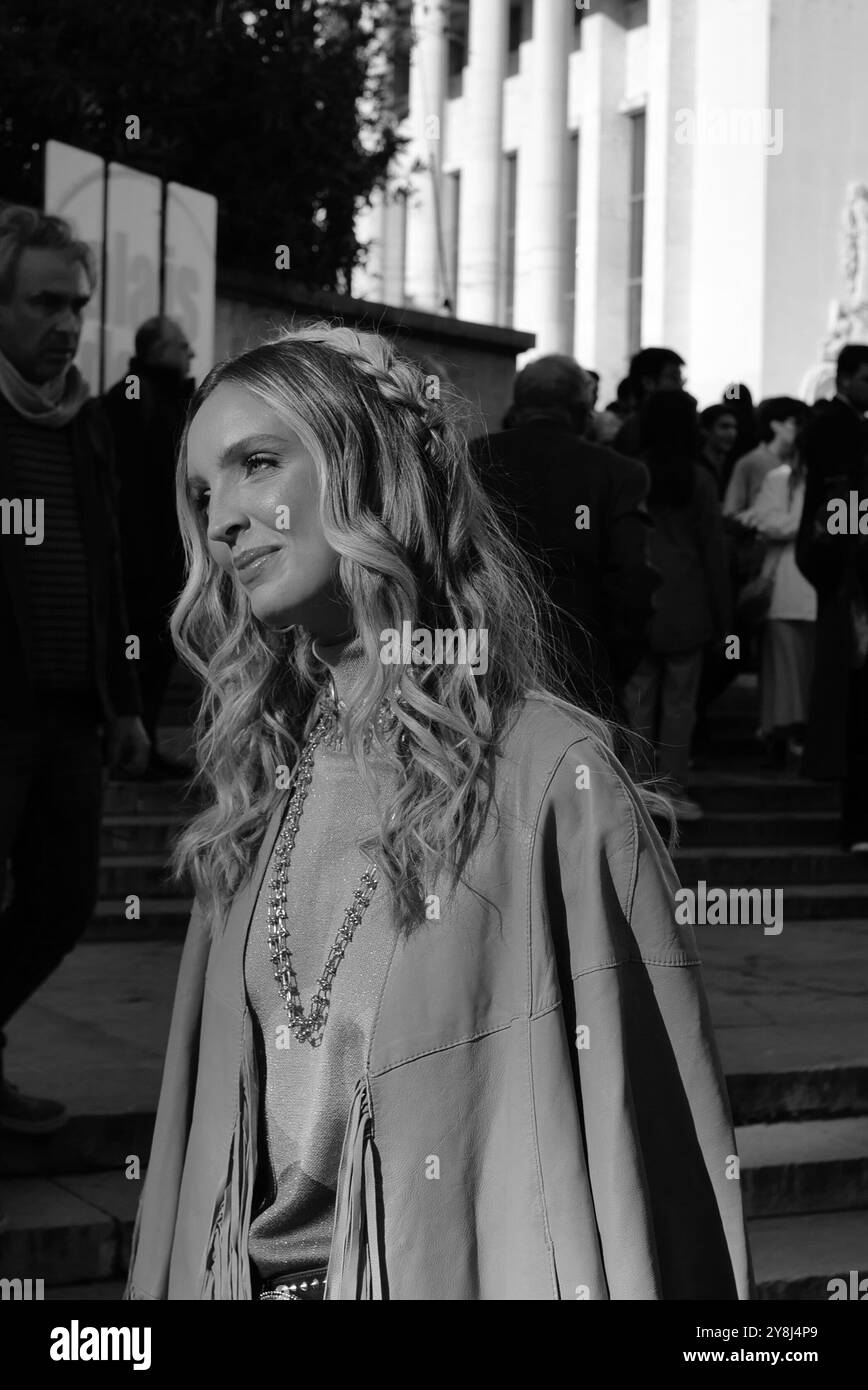 Cris Mata wearing turtle neck sweater, a plaid skirt, wrapped sweater ...