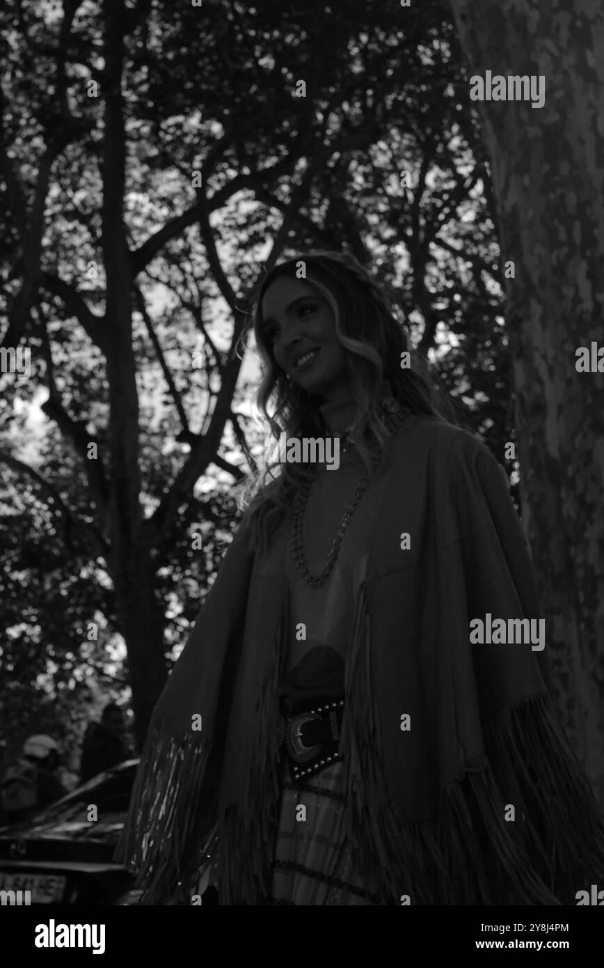 Cris Mata wearing turtle neck sweater, a plaid skirt, wrapped sweater ...