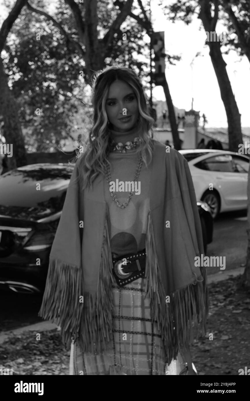 Cris Mata wearing turtle neck sweater, a plaid skirt, wrapped sweater ...