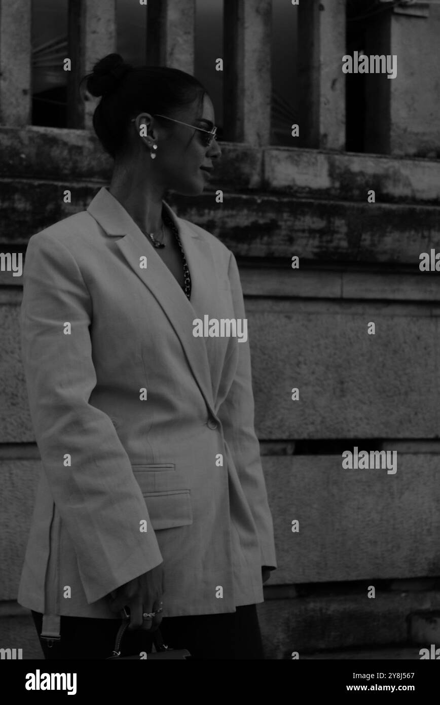 Rasha Al-Rifaie wearing a formal white 2 piece with an oversized blazer ...