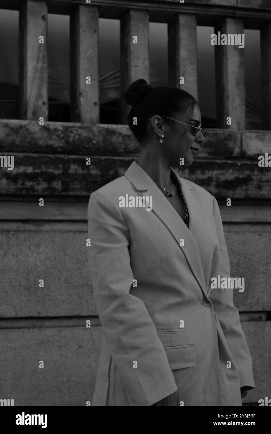 Rasha Al-Rifaie wearing a formal white 2 piece with an oversized blazer ...