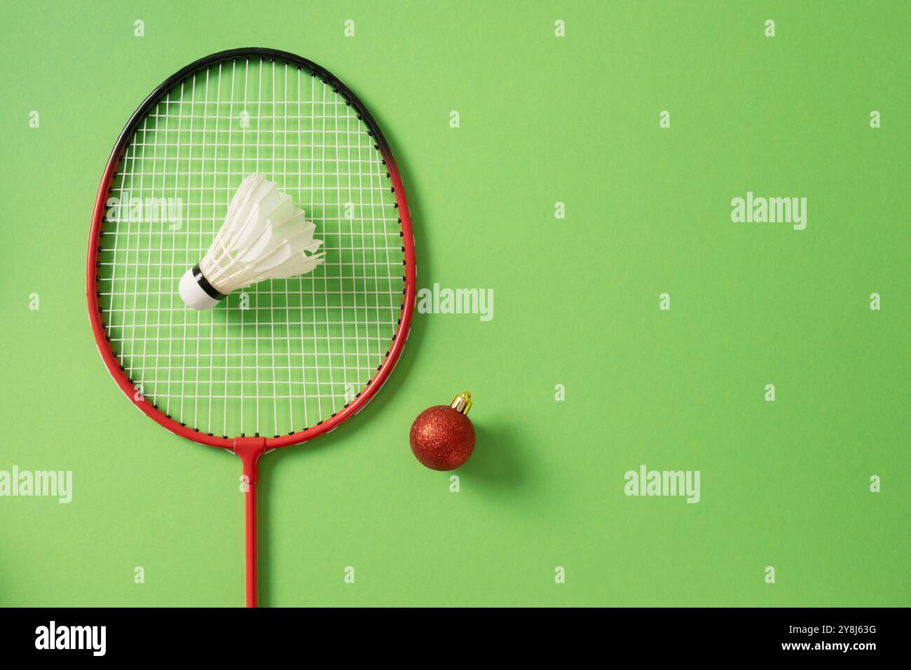 Christmas badminton concept with racket and white feather badminton ...