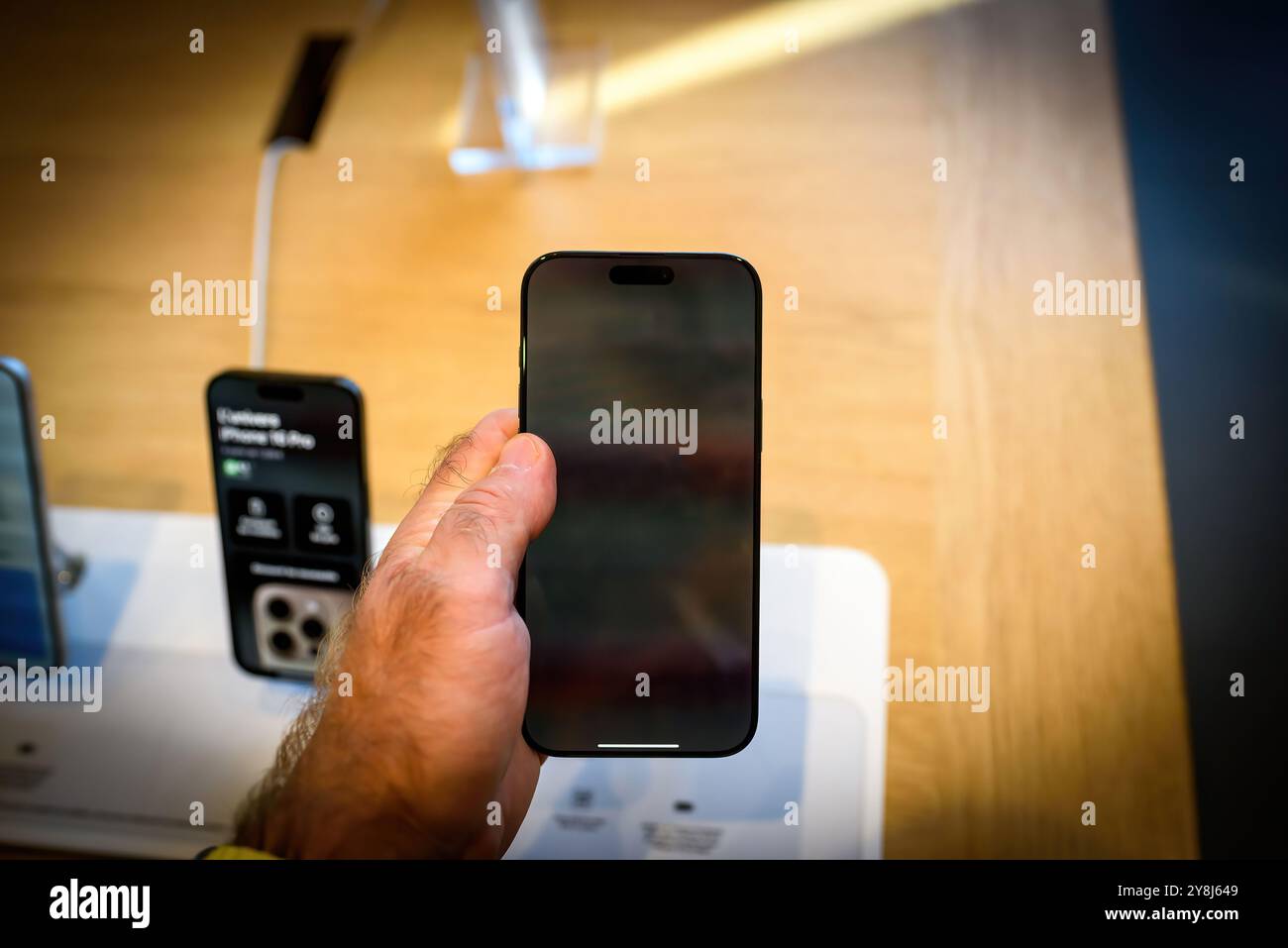 Paris, France - Sep 20, 2024: A male hand holds an iPhone 16 Pro Max ...