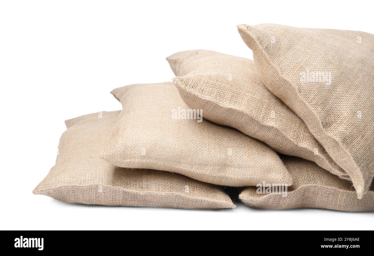 Group of burlap sacks isolated on white Stock Photo - Alamy