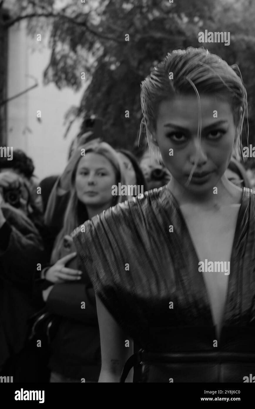 Michelle Dee wearing a sleeveless jumpsuit with a midwaist belt at the ...