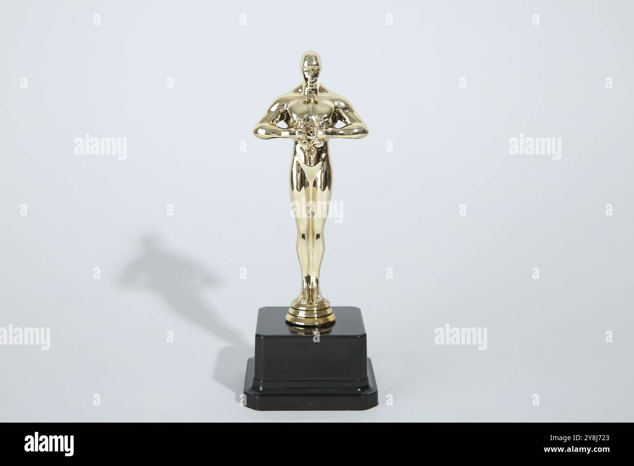 One golden Oscar award on light background Stock Photo - Alamy