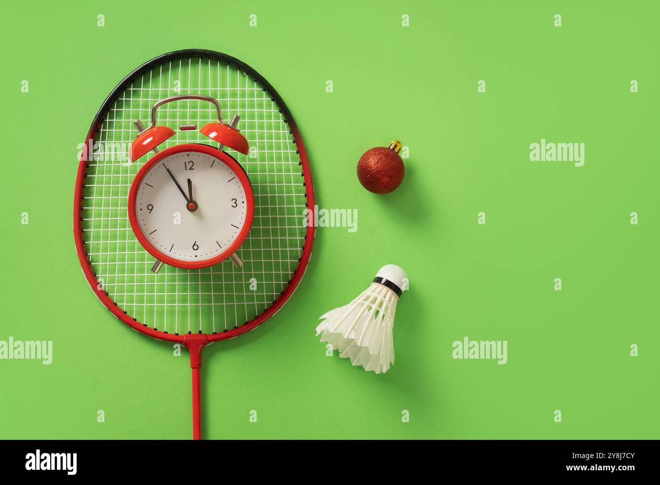 Christmas badminton concept with racket, red ball and white feather ...