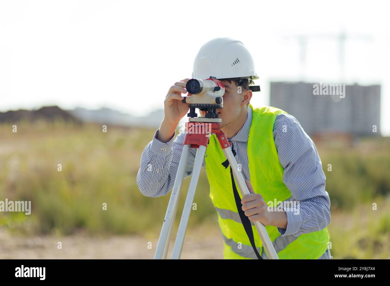 Survey engineer working with operating level survey cameras on ...
