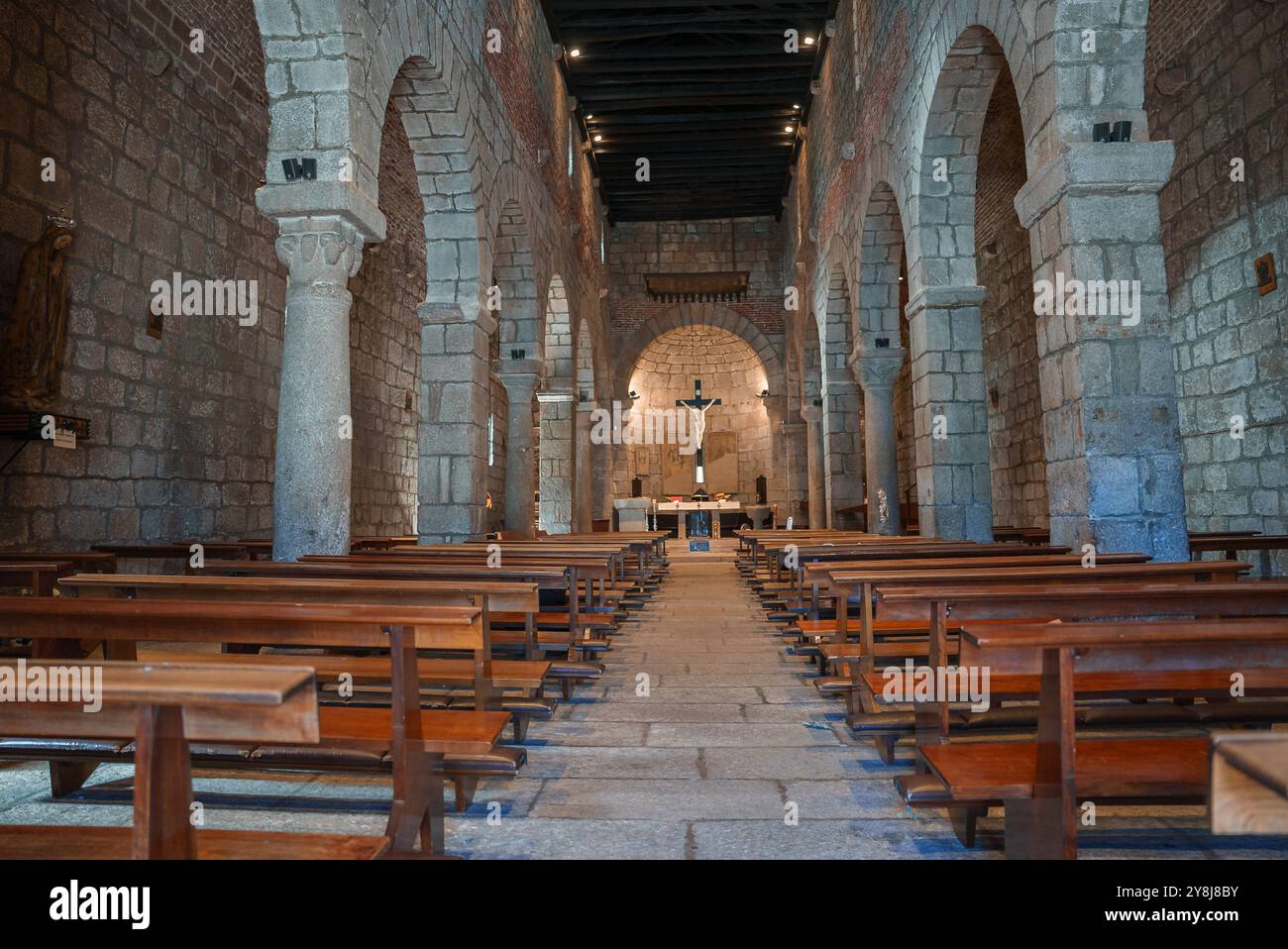 Romanesque Church Interior with Stone Arches and Wooden Beams in ...
