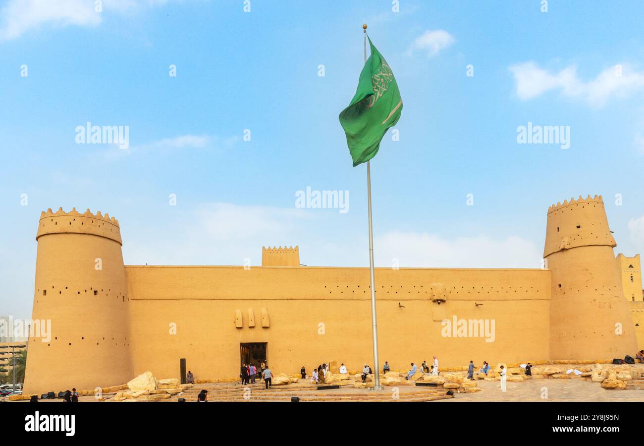 Masmak Fortress towers and walls with green Saudi Arabian national flag ...