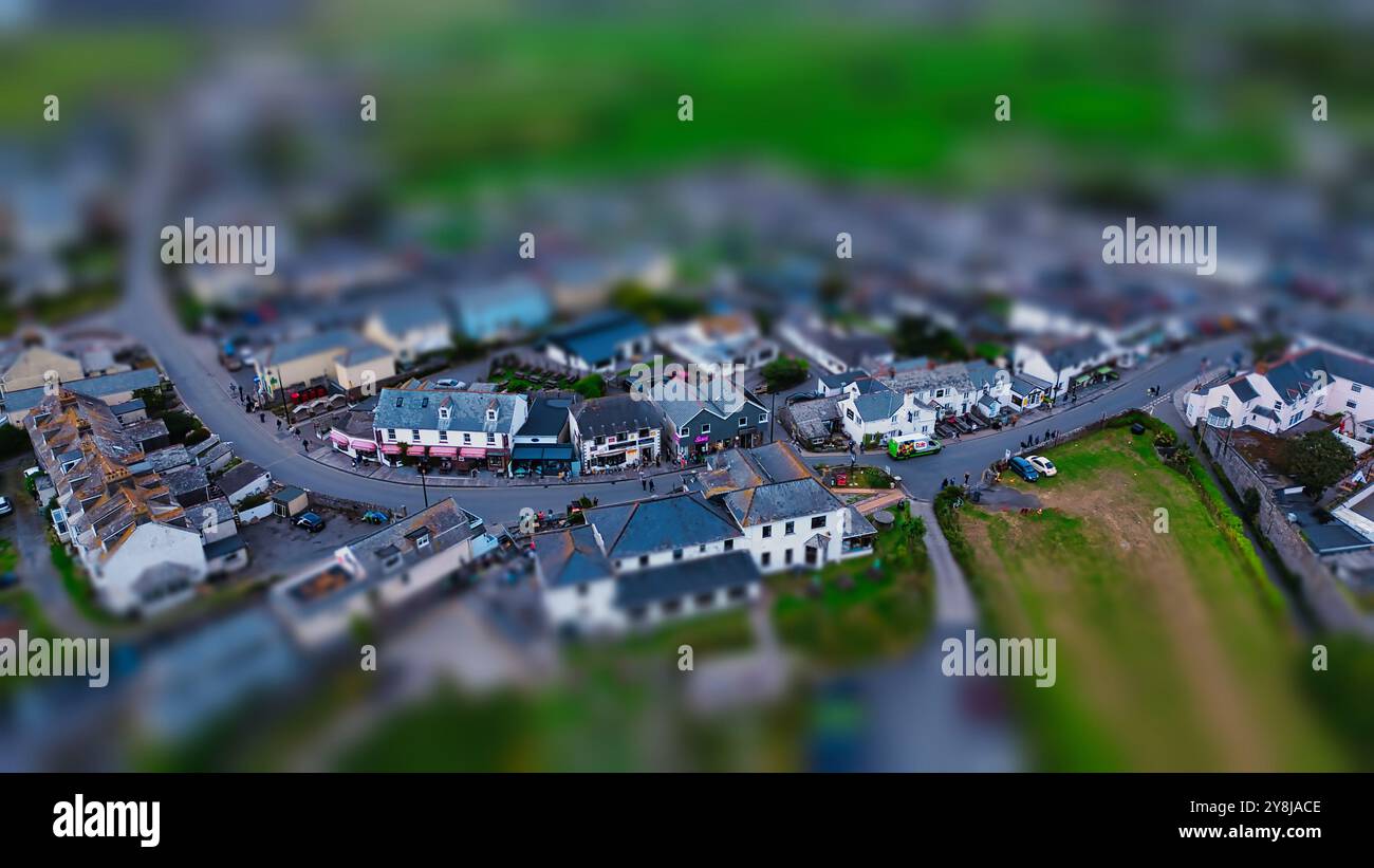 Aerial view of a small town with winding streets, featuring a mix of ...