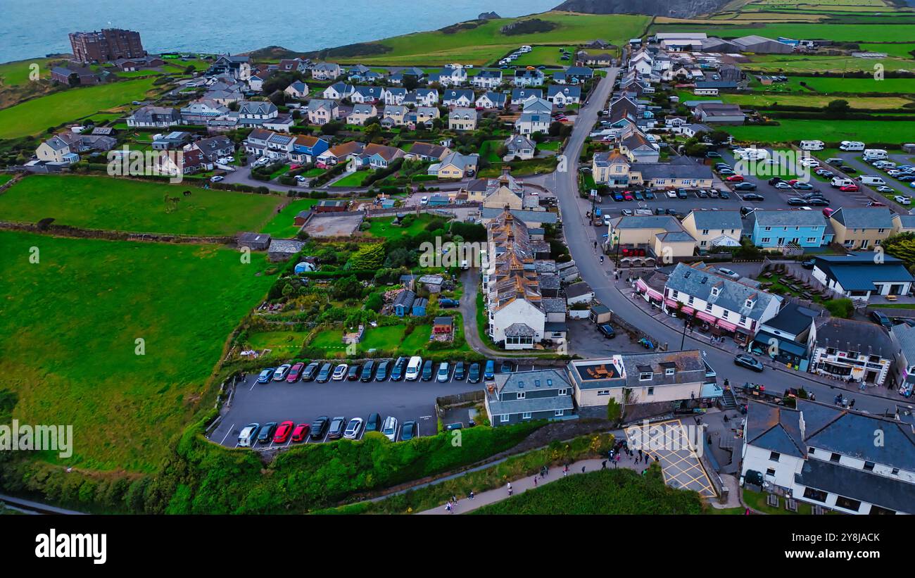Aerial view of a coastal village with a mix of residential and ...