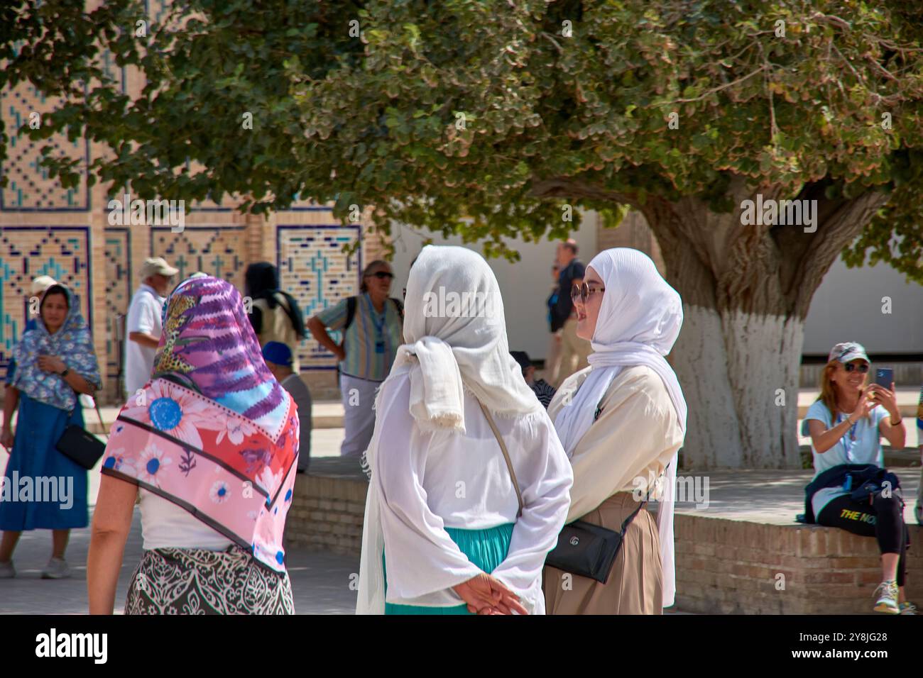 Bukhara,Uzbekistan; September,19,2024:a group of Muslim women, each ...