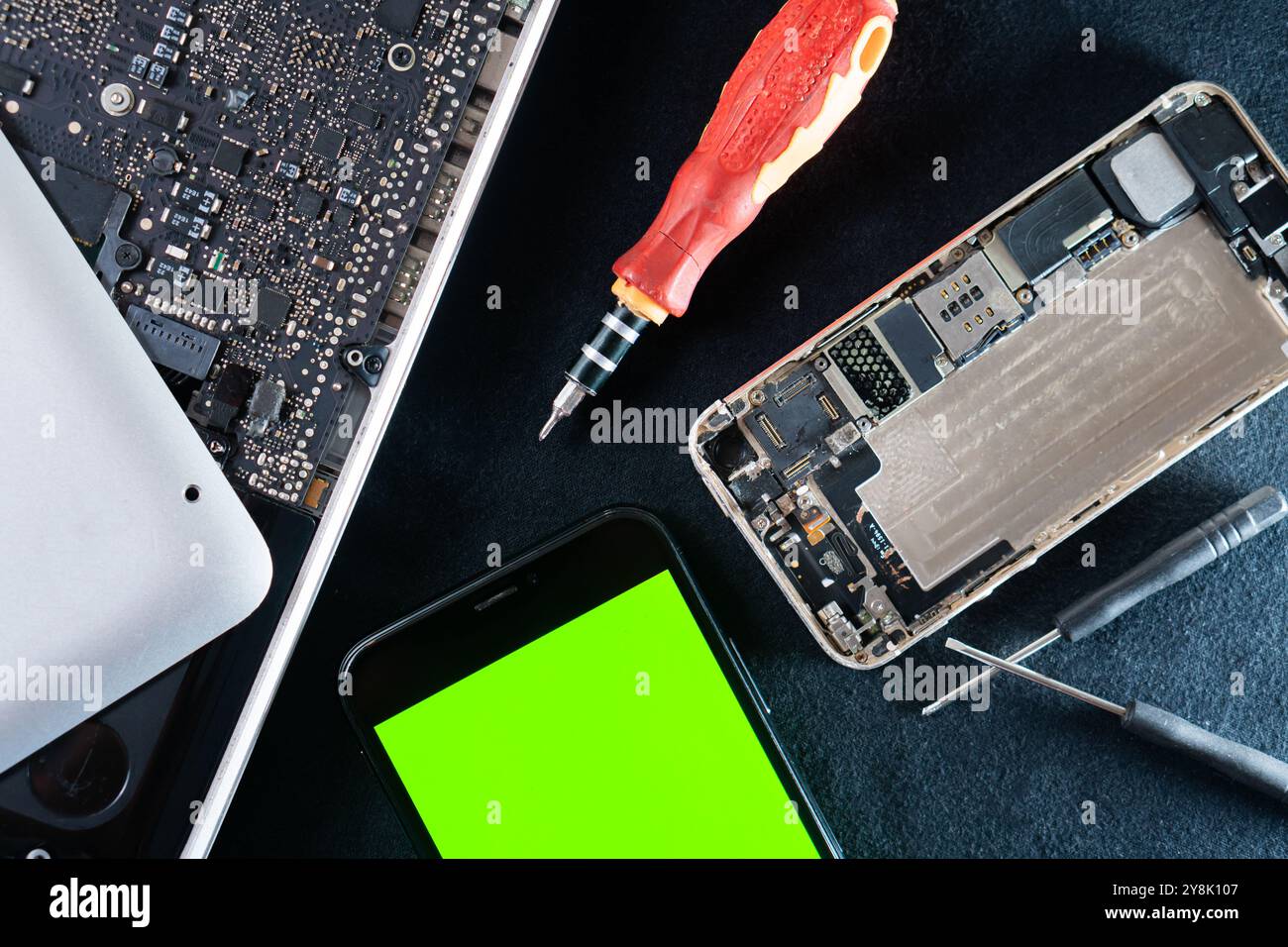 An overhead view of disassembled electronic devices, including a smart ...