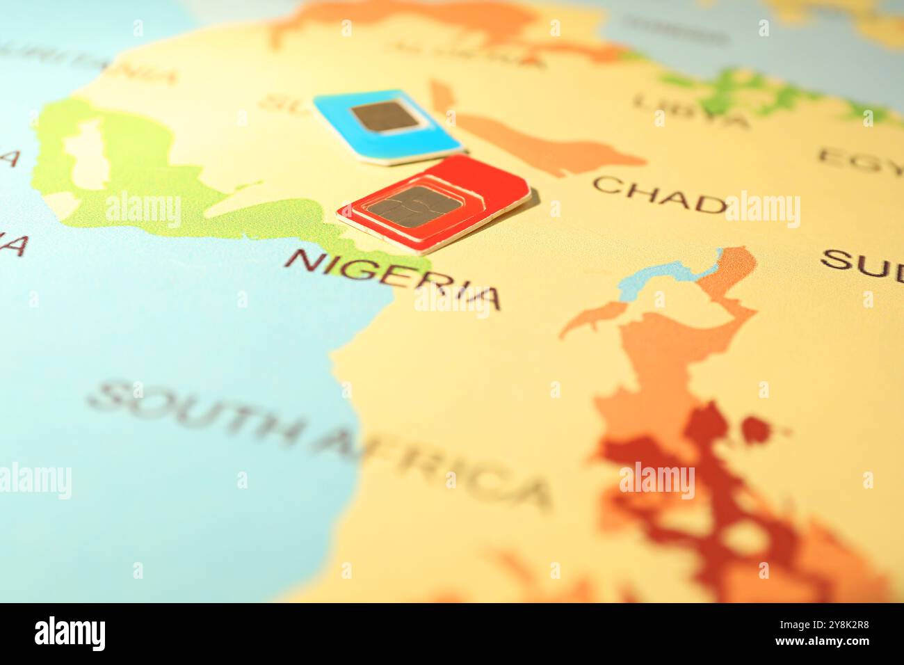 Modern SIM cards on world map, closeup Stock Photo - Alamy