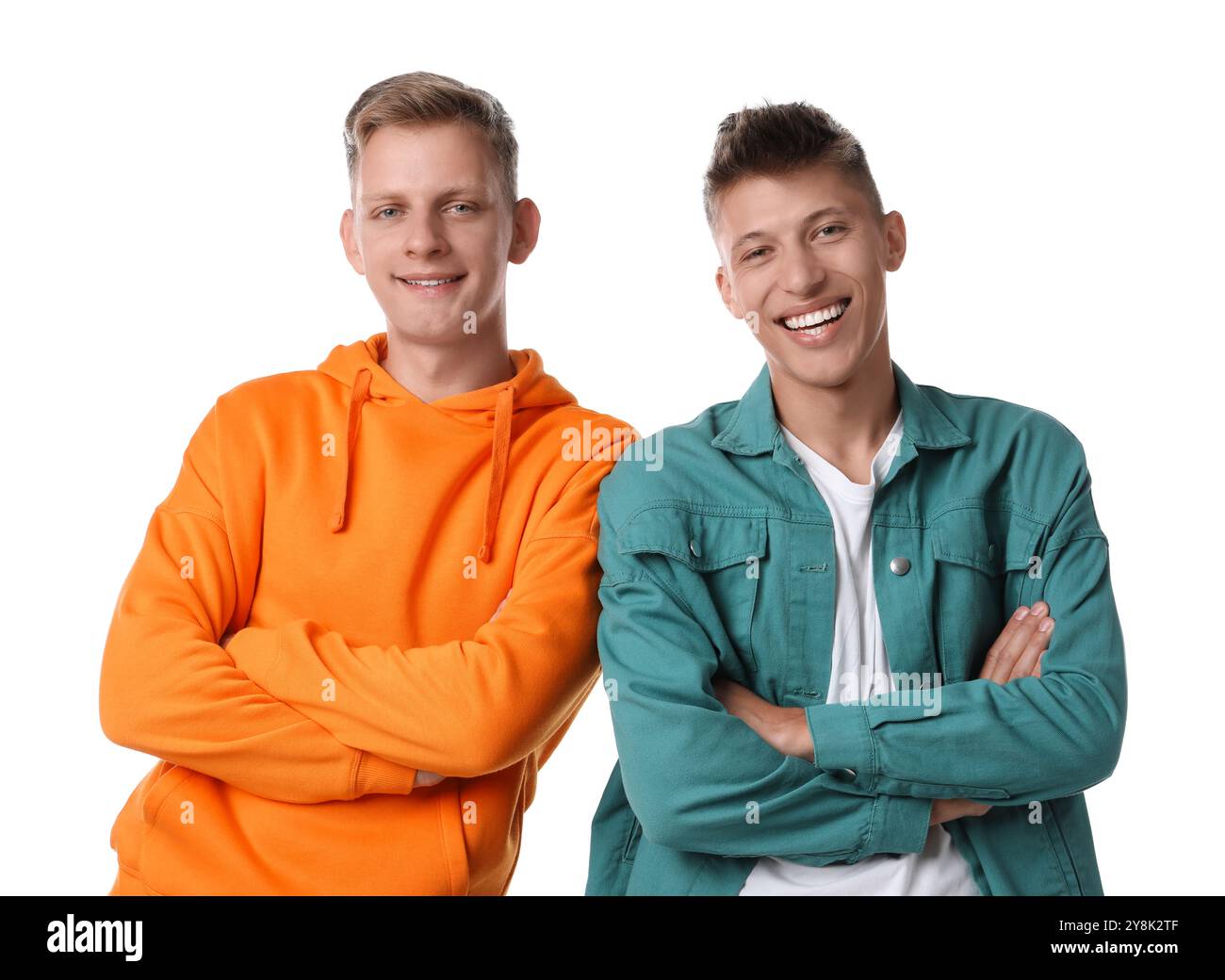 Two happy brothers posing with crossed arms on white background Stock ...