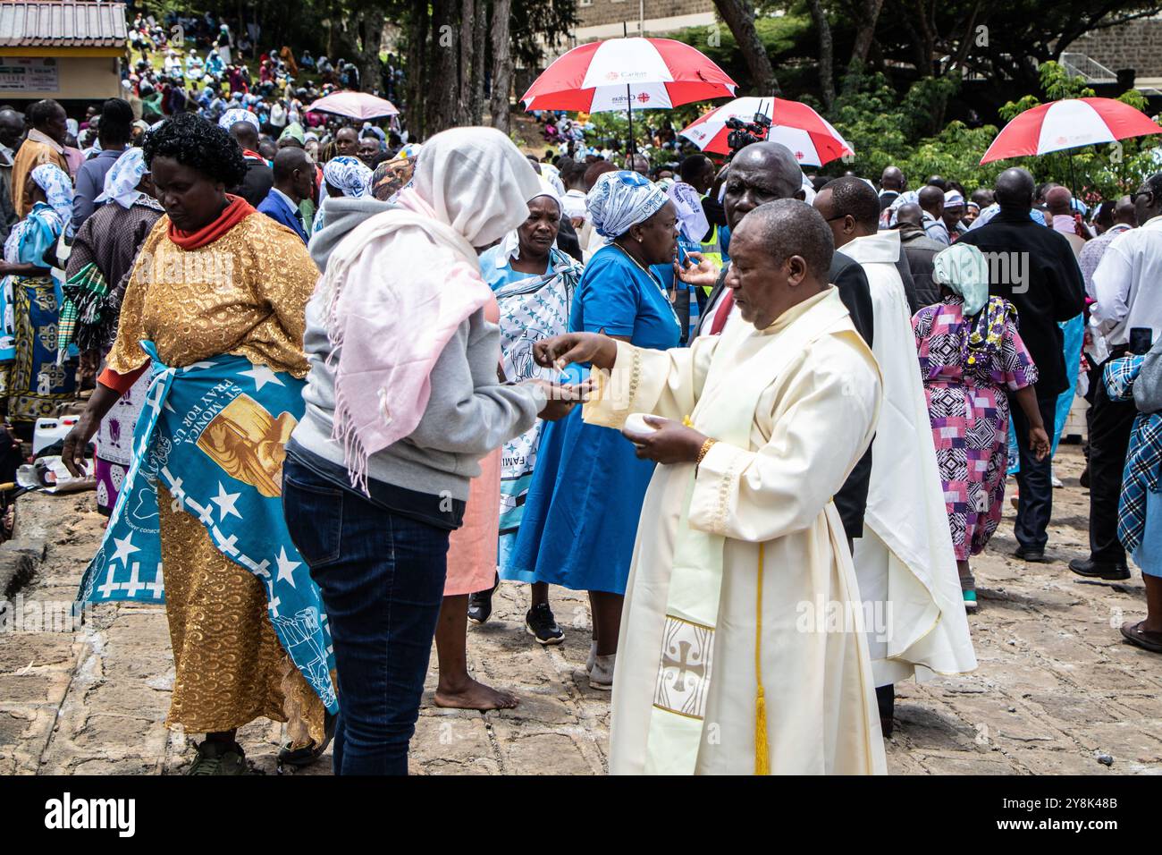 Nakuru, Kenya. 05th Oct, 2024. Catholic faithful receive Holy Communion ...