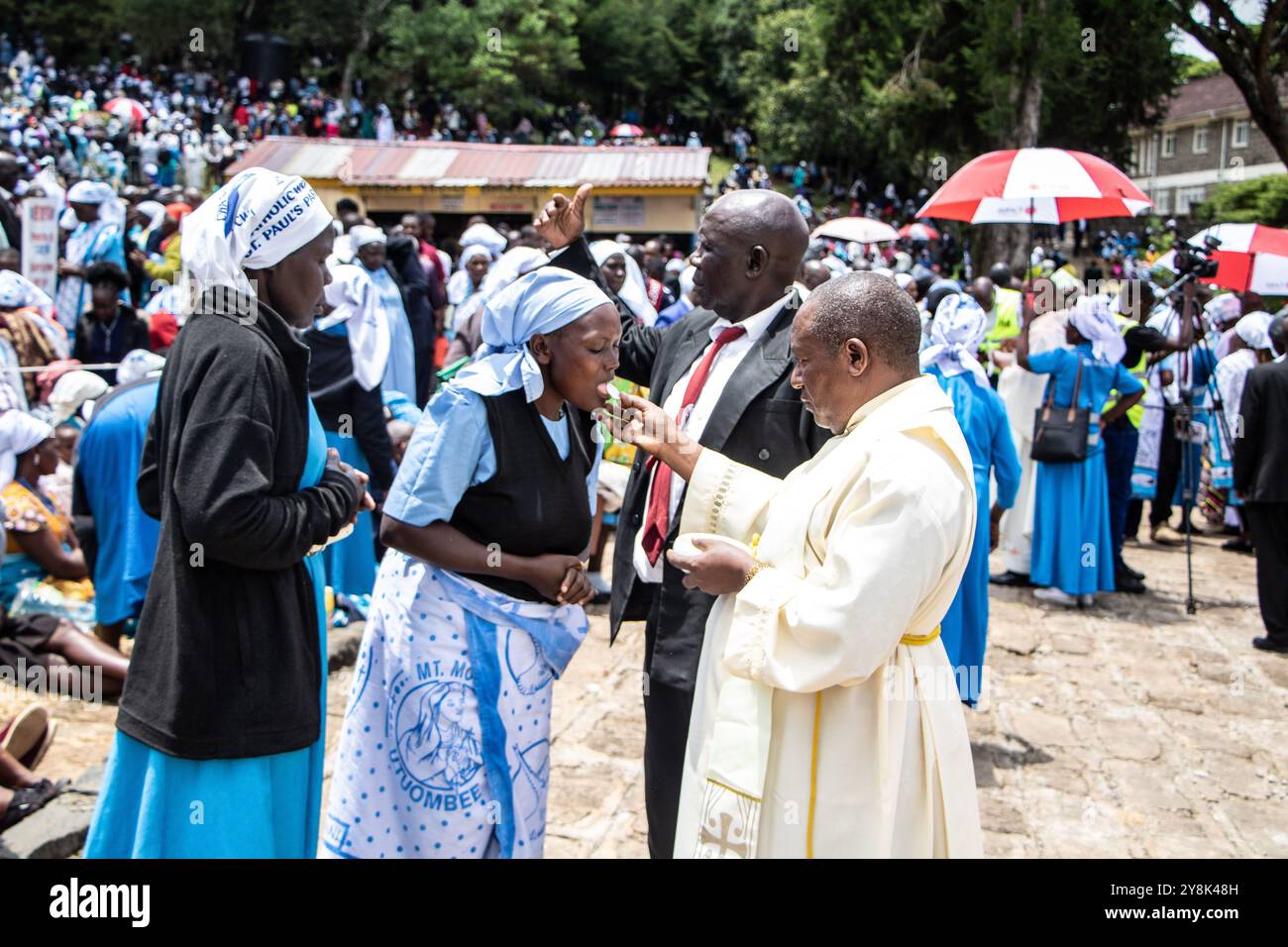 Nakuru, Kenya. 05th Oct, 2024. Catholic faithful receive Holy Communion ...