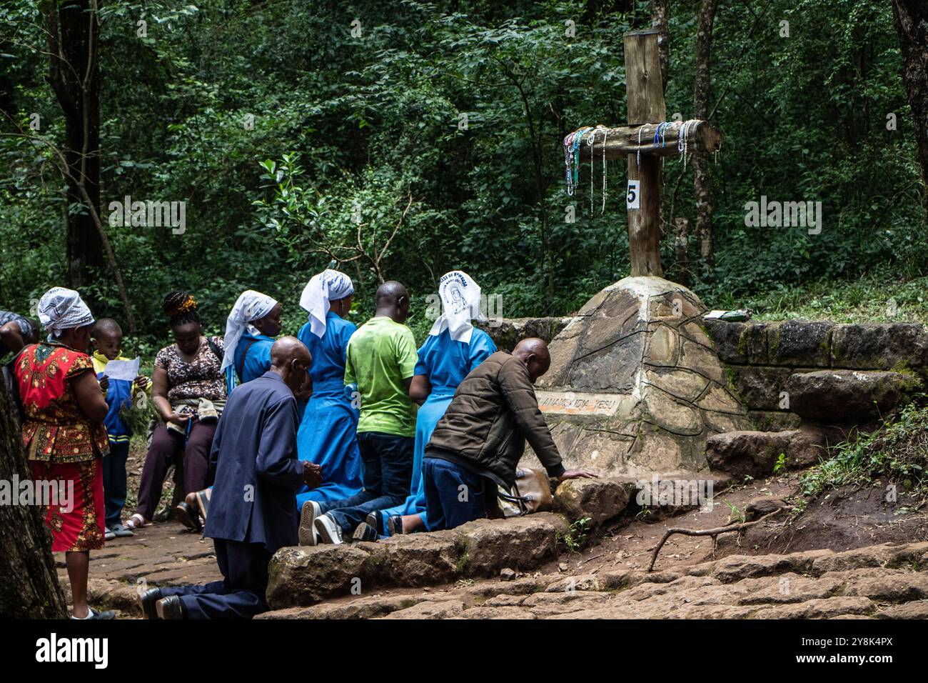 Nakuru, Kenya. 05th Oct, 2024. Catholic faithful kneel to pray during ...