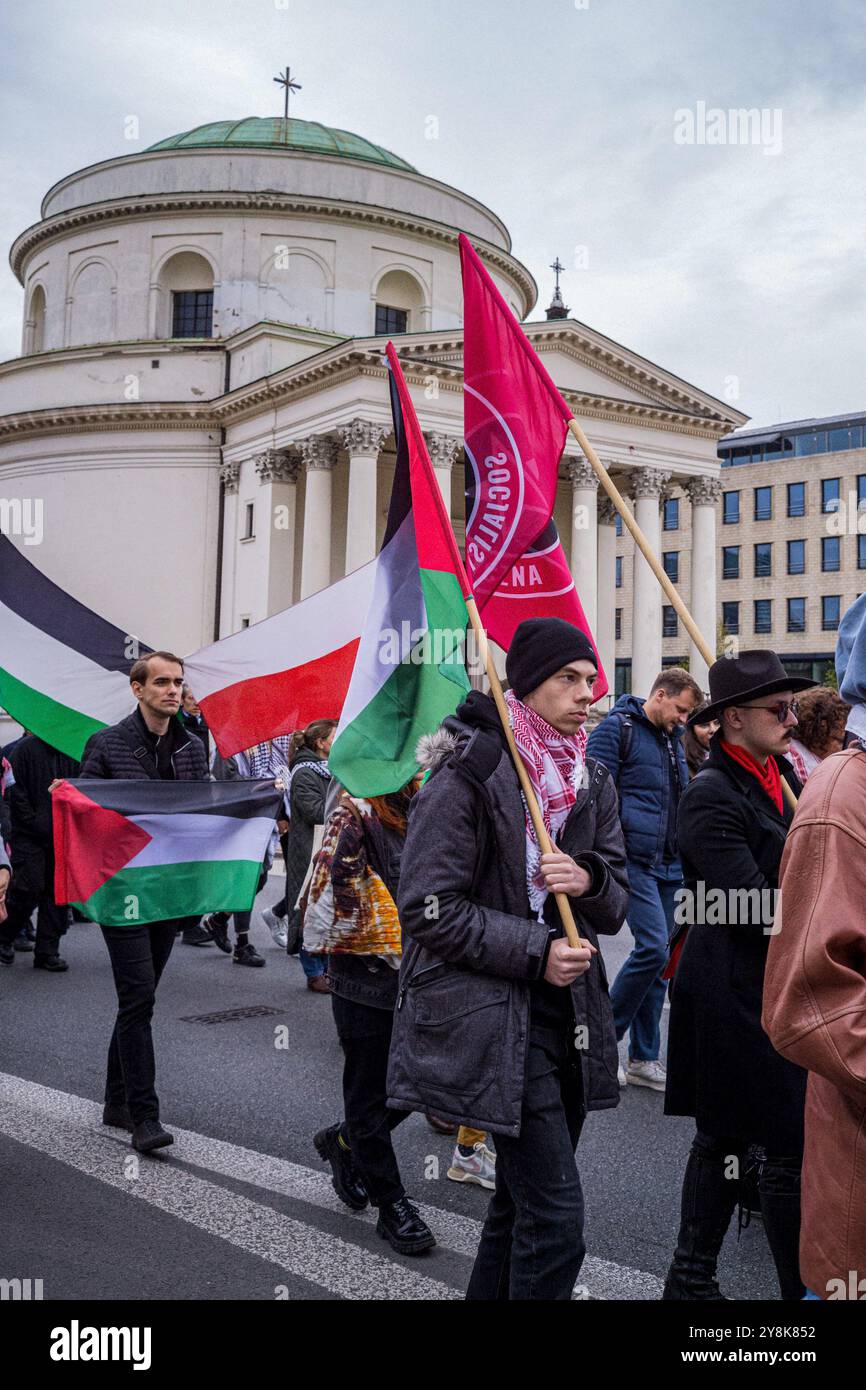 Warsaw, Poland. 5th Oct 2024. Protesters hold Palestinian flags and ...