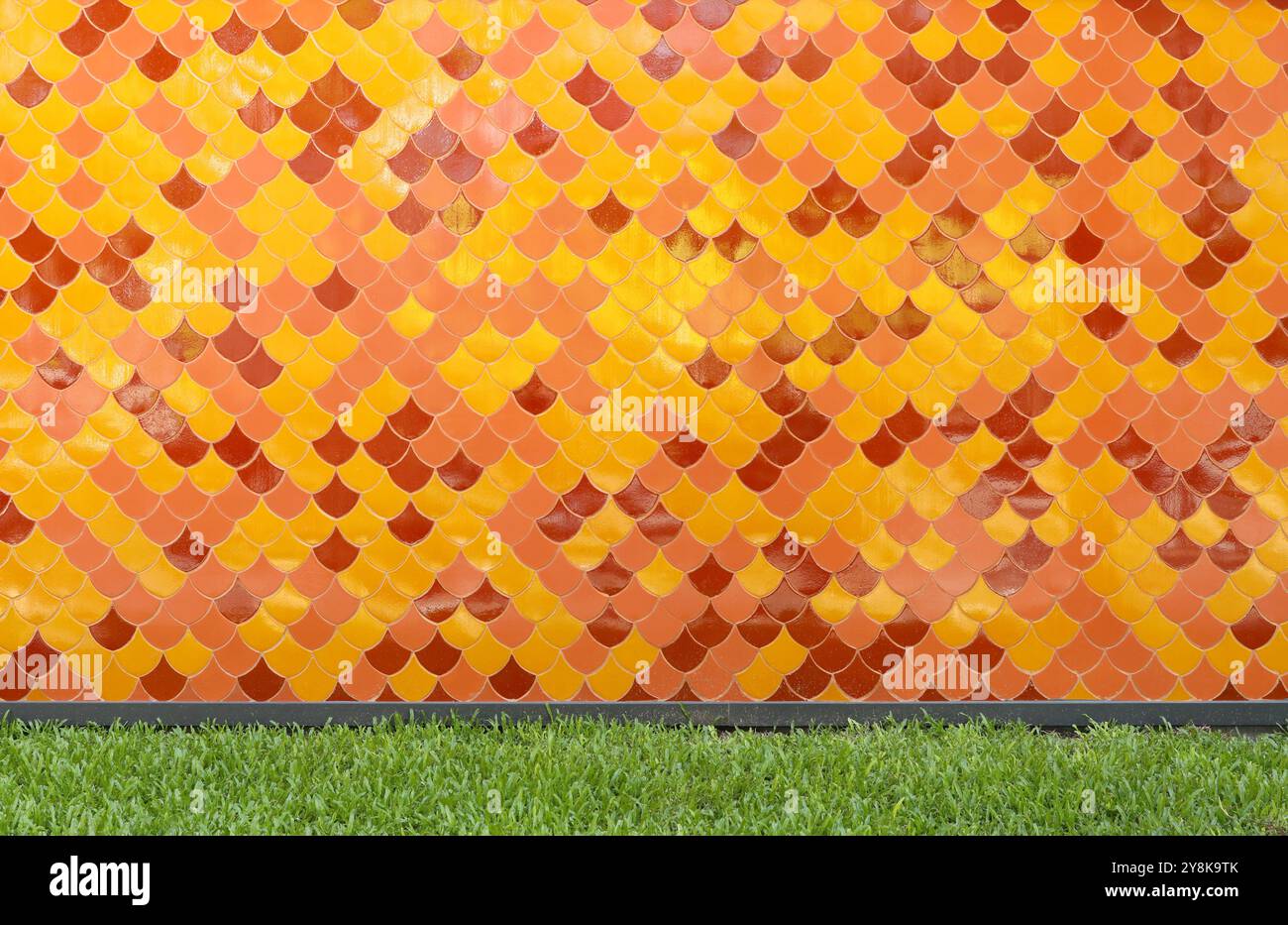 Colorful ceramic tiled wall natural green grass floor Stock Photo - Alamy