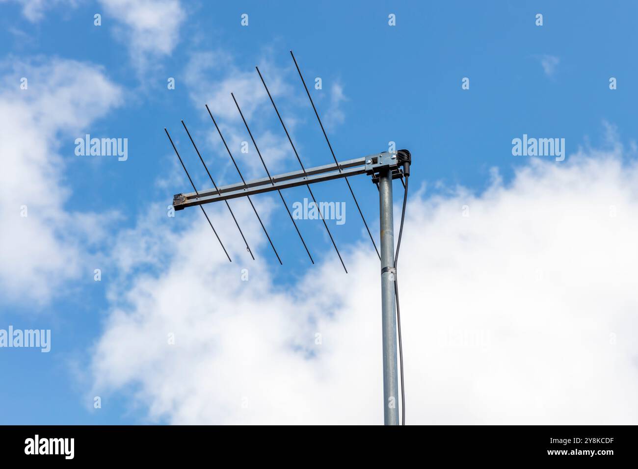 Photograph of a traditional television antenna on a residential house ...